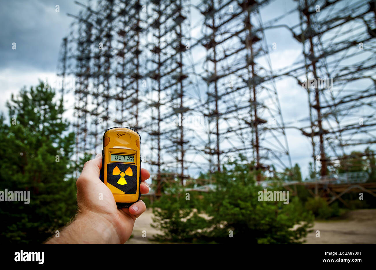 Dosimeter in hands with a level of radioactivity at 0.27 gamma ...