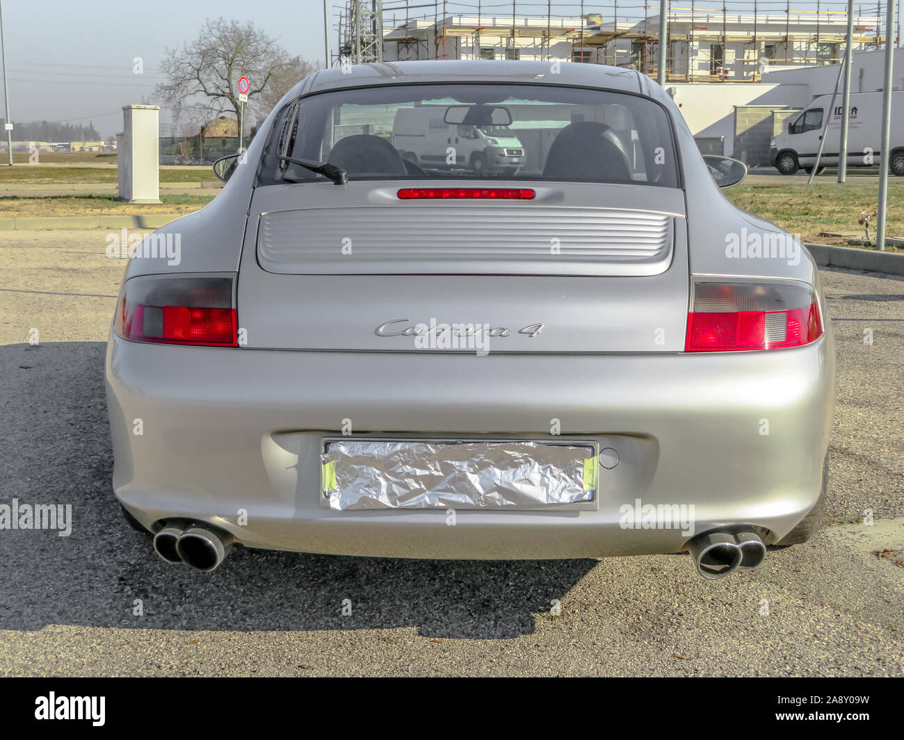 Sport car park behind road hi-res stock photography and images - Alamy