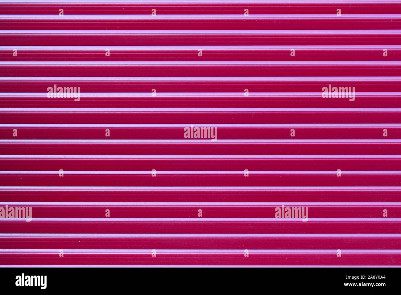 Closed red roller shutter for background or wallpaper Stock Photo - Alamy