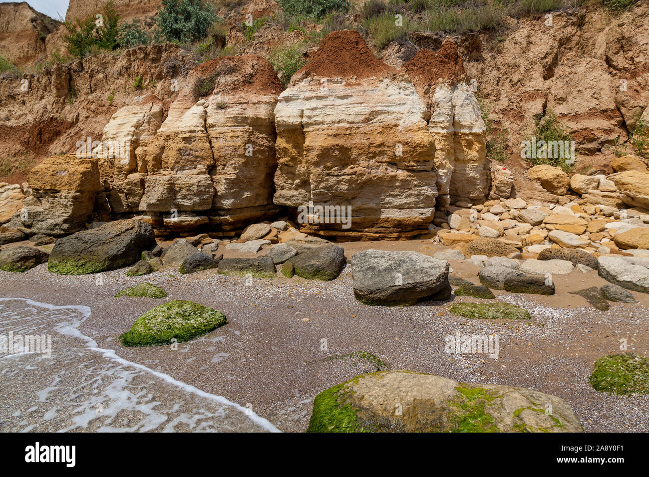 Yellow sandy rocks and stones of various forms on the Black Sea coast ...