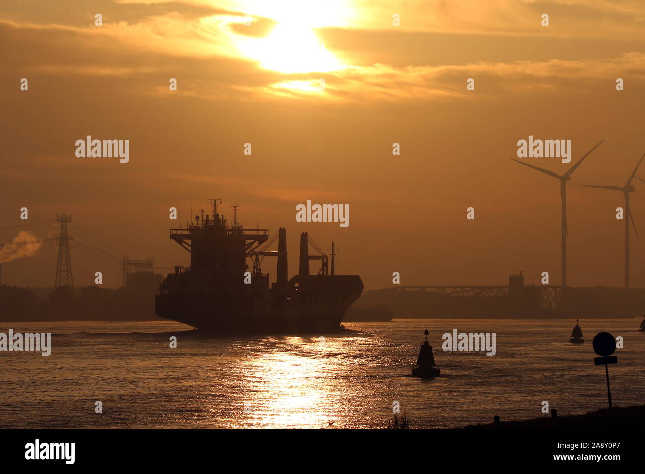 Container ship in the sunrise Stock Photo - Alamy