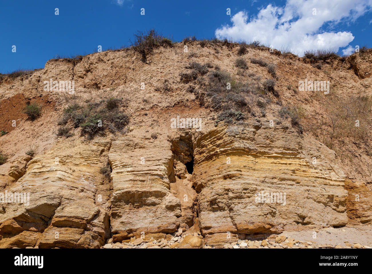 Yellow sandy rocks and stones of various forms on the Black Sea coast ...
