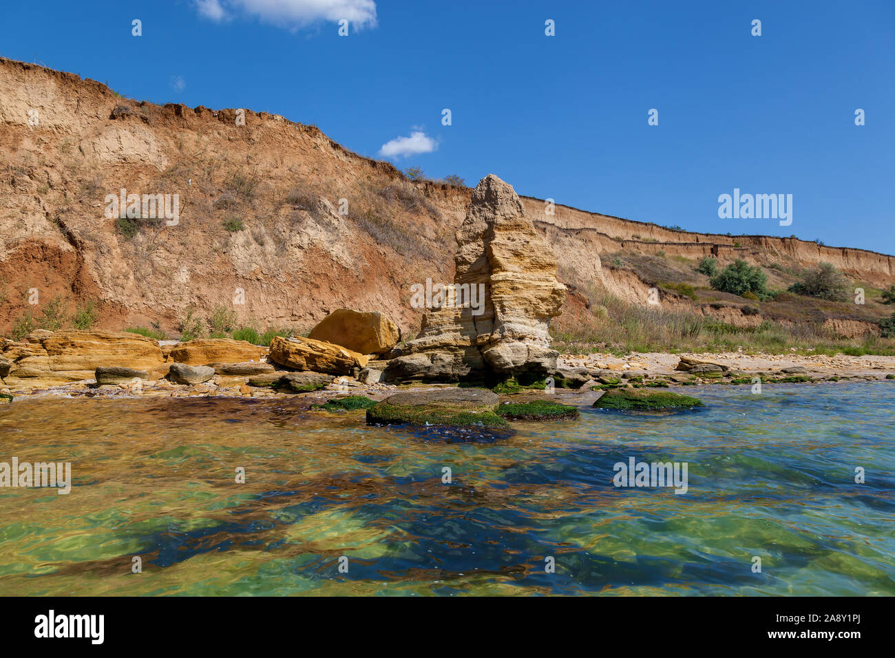 Yellow sandy rocks and stones of various forms on the Black Sea coast ...