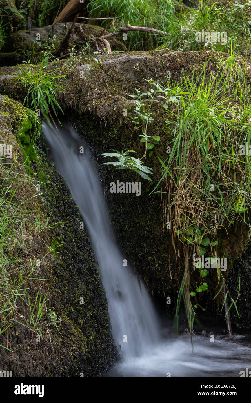 Long exposure of a waterfall on the West Lyn river flowing through the ...