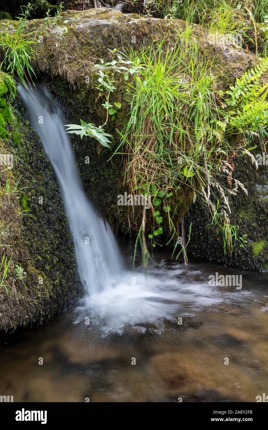 Long exposure of a waterfall on the West Lyn river flowing through the ...