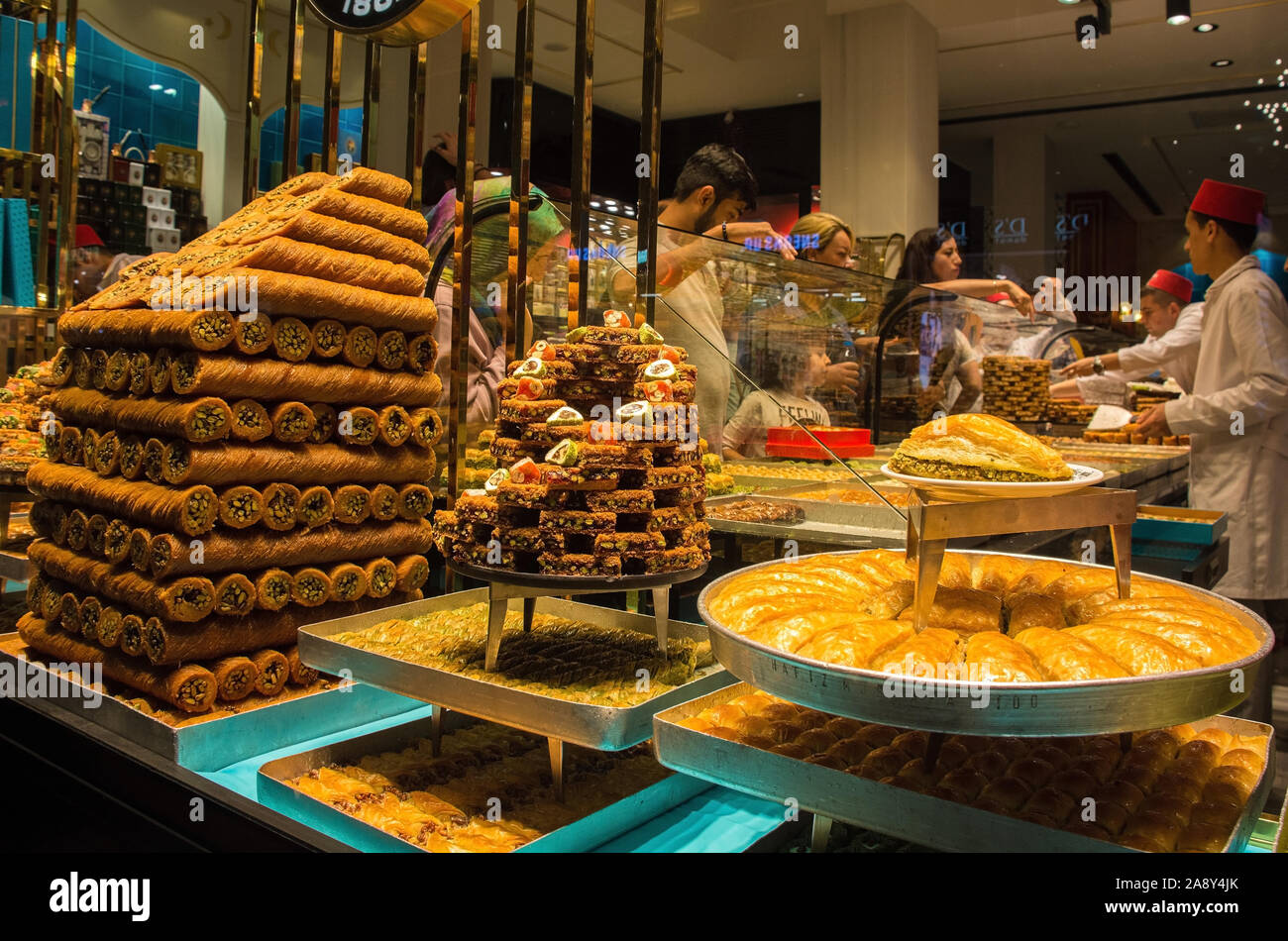 Istanbul, Turkey - September 7th 2019. Shop workers serve customers ...