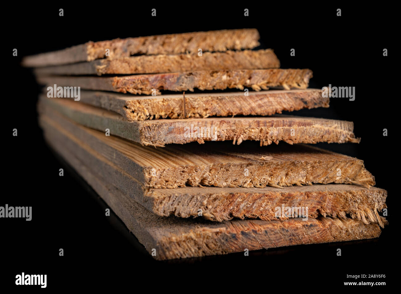 Raw wooden boards. Heavily jagged wood edges. Dark background Stock ...