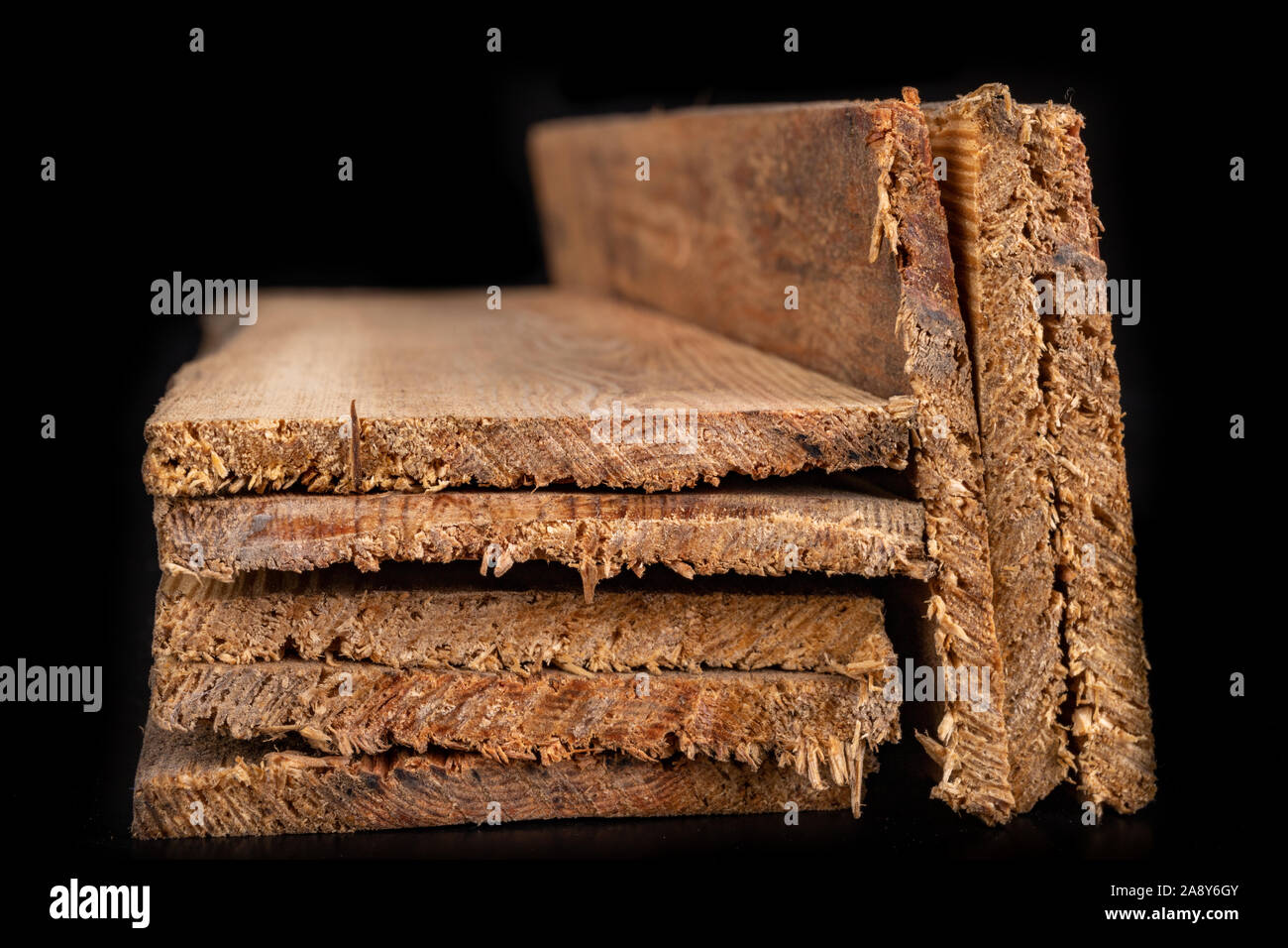 Raw wooden boards. Heavily jagged wood edges. Dark background Stock ...