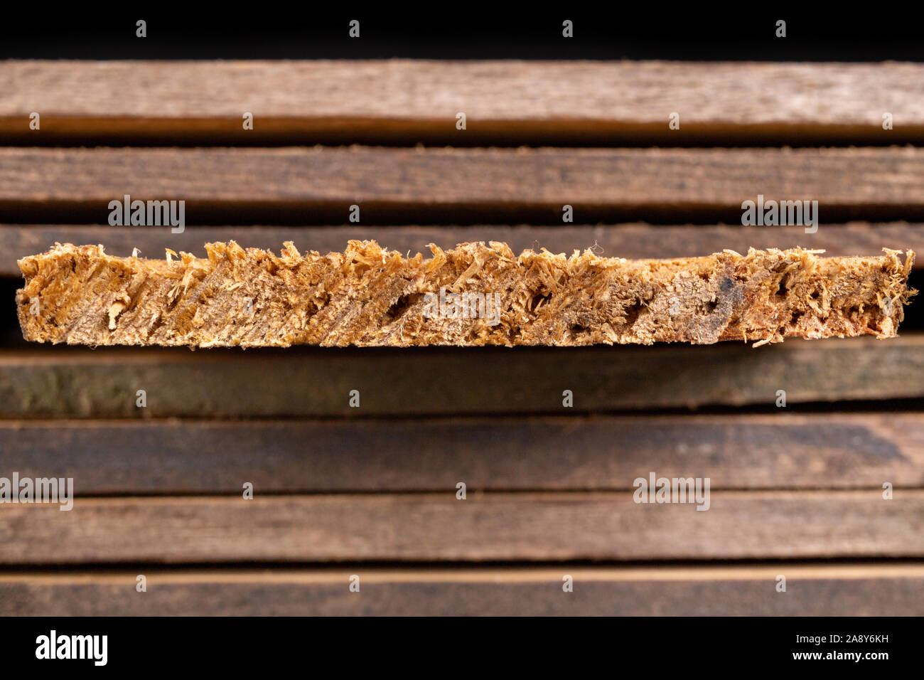 Raw wooden boards. Heavily jagged wood edges. Dark background Stock ...