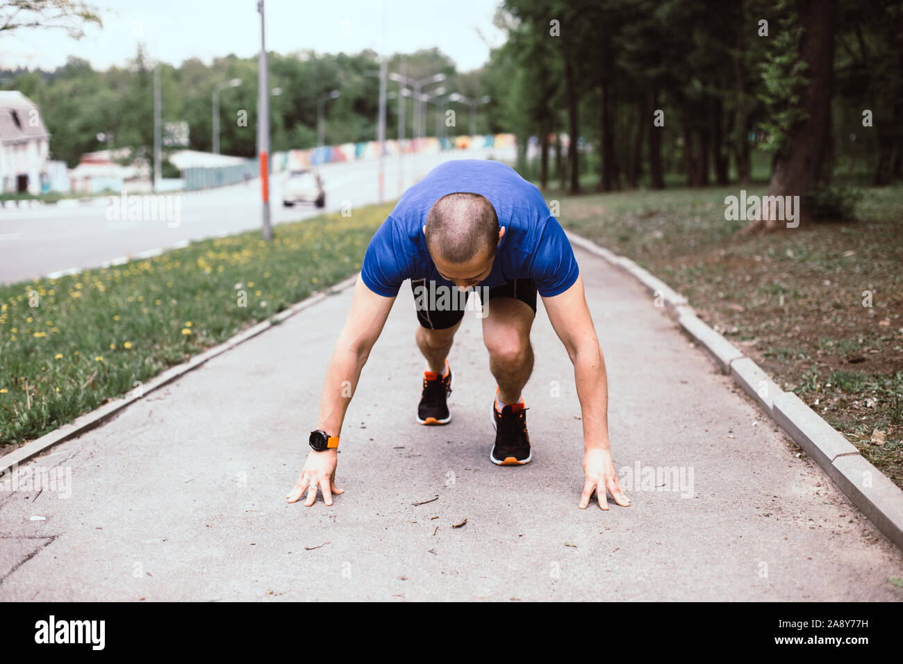 Muscular male runner running hi-res stock photography and images - Alamy