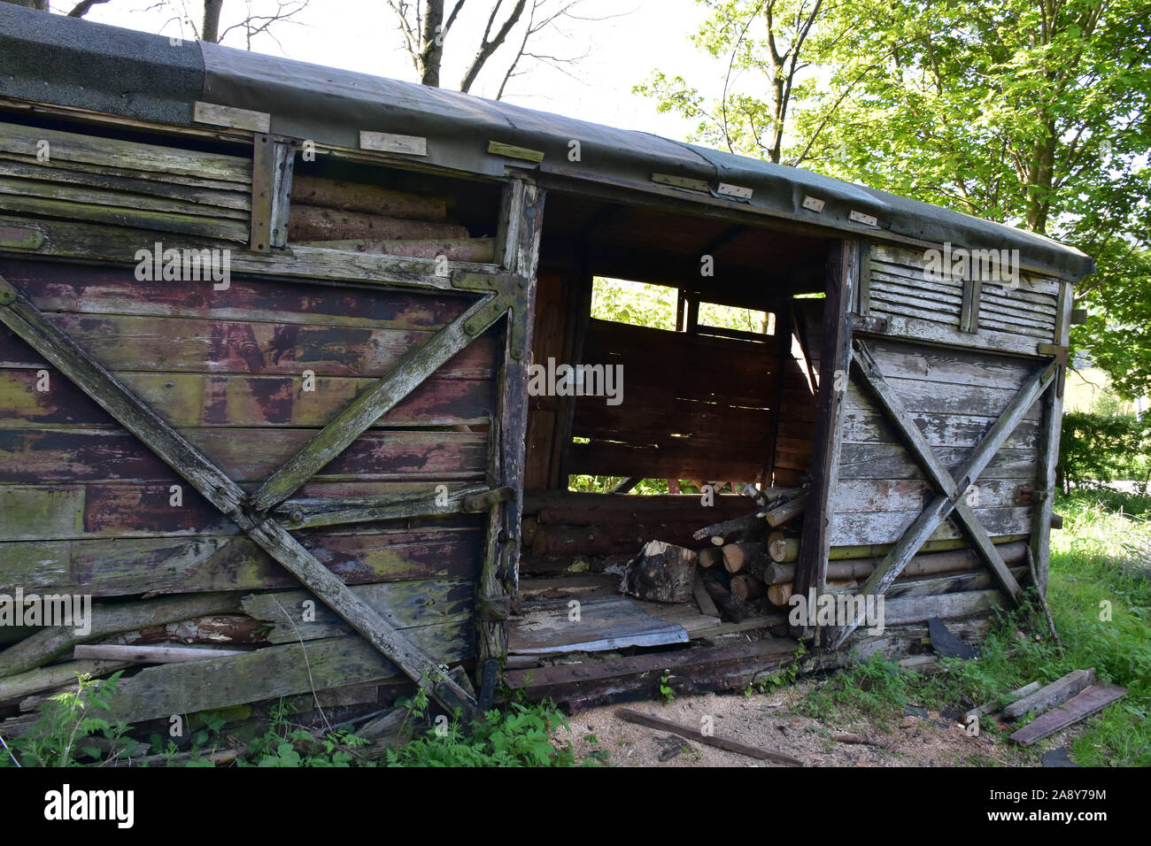 Wood storage building for storing cut wood Stock Photo - Alamy