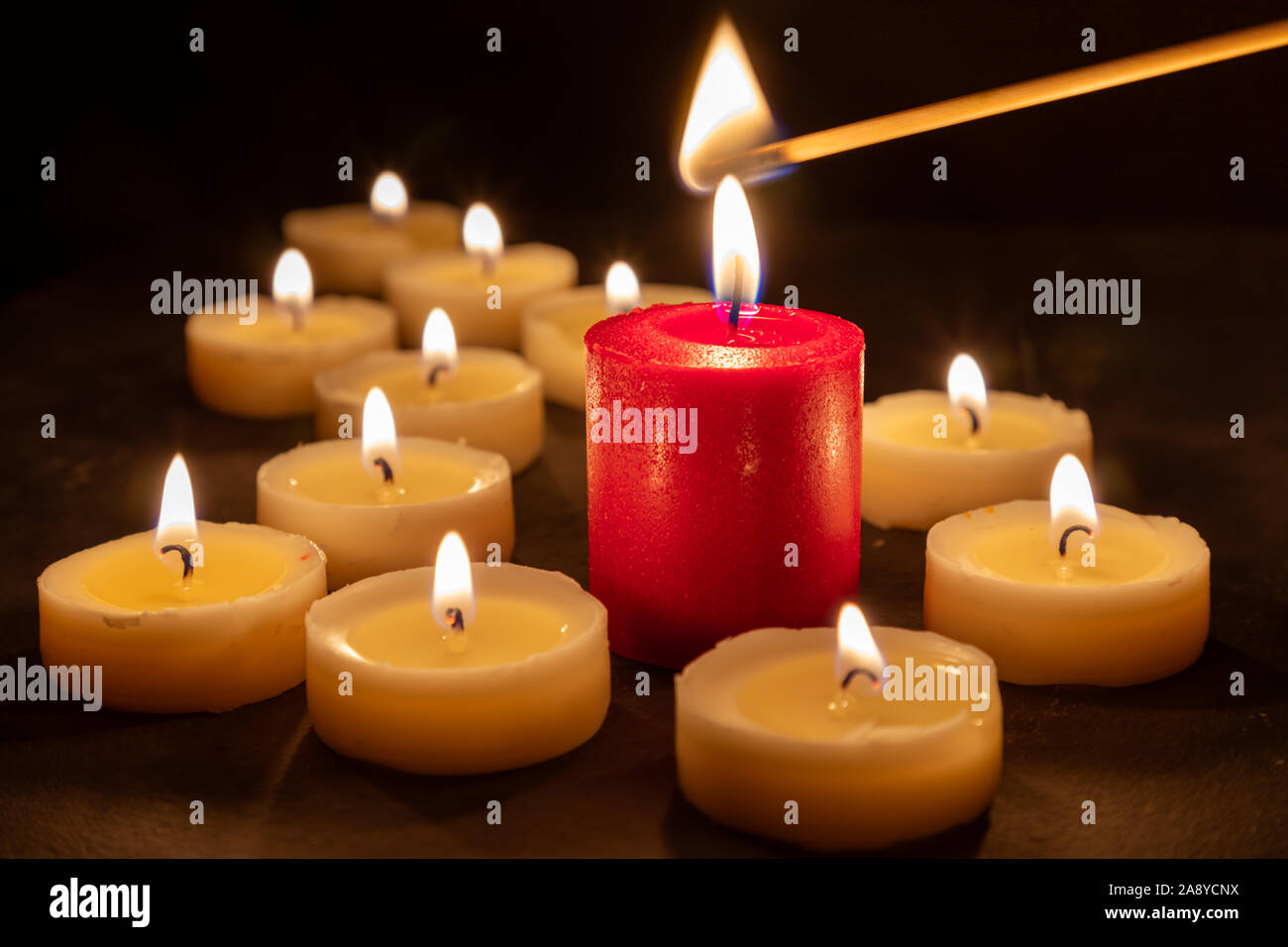 Many candles glowing hi-res stock photography and images - Alamy