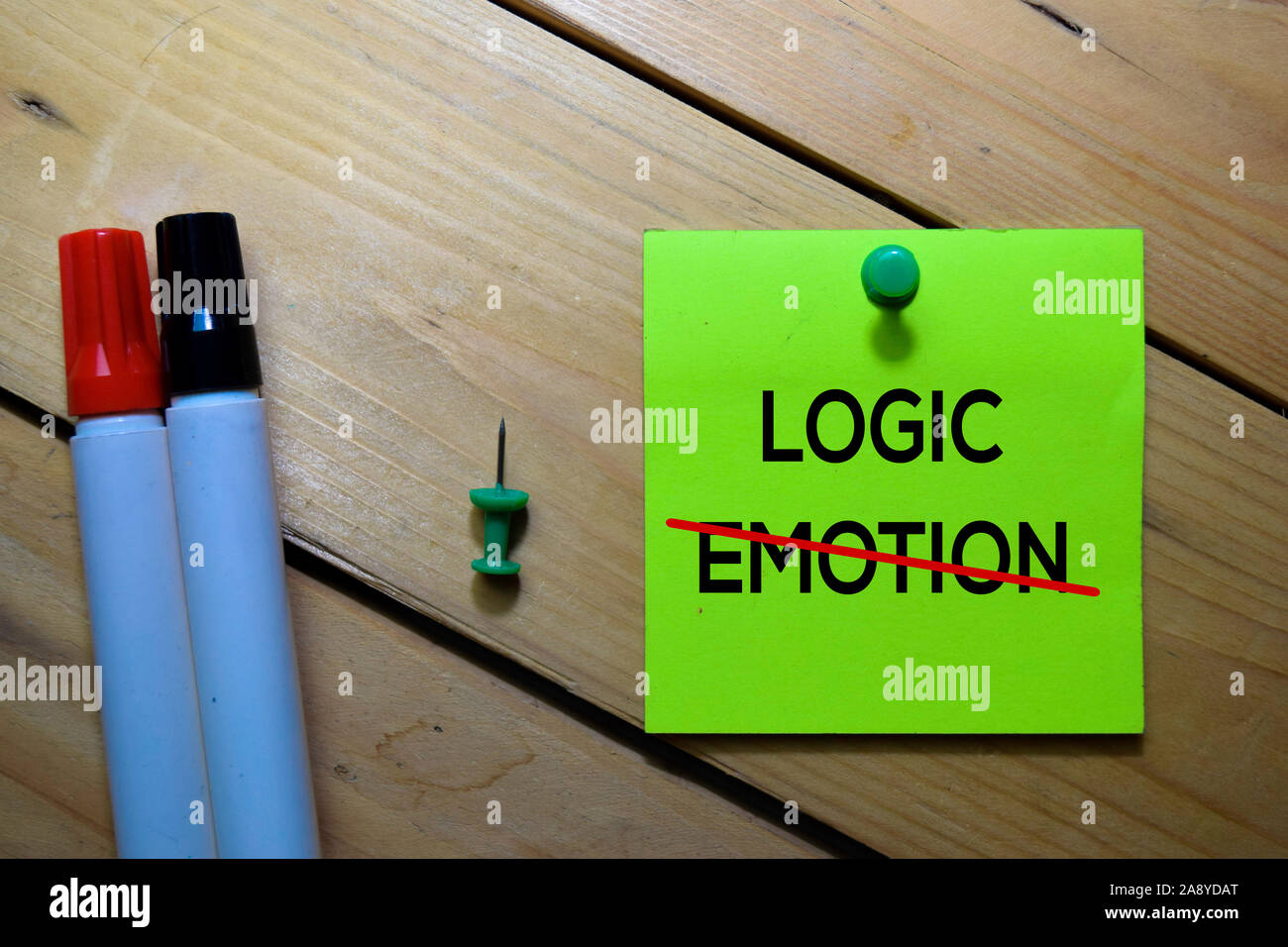 logic-vs-emotion-text-on-sticky-notes-isolated-on-the-tables-stock