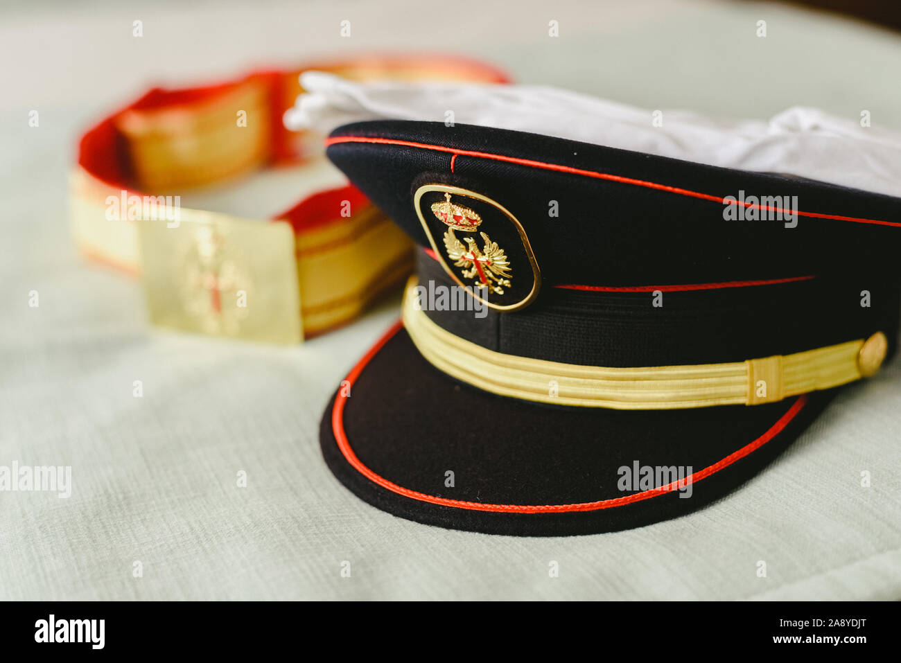 Captain cap and belt of military uniform Stock Photo - Alamy