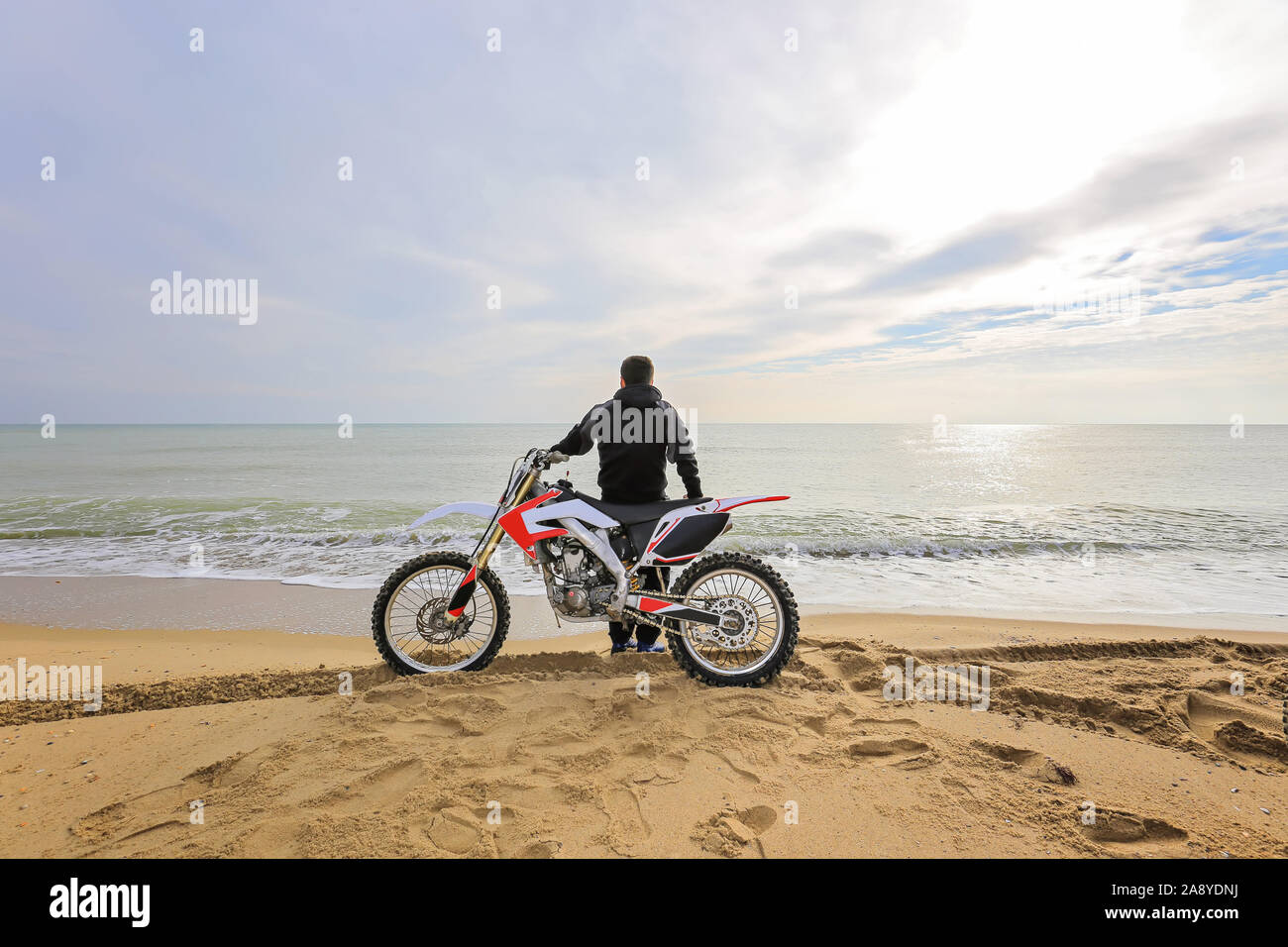 Man riding motorcycle on beach hi-res stock photography and images - Alamy