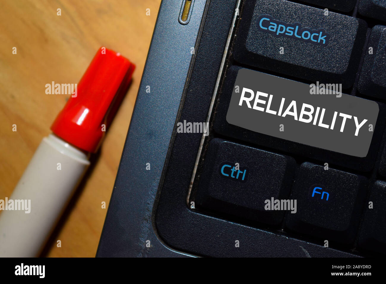 Reliability write on keyboard isolated on laptop background Stock Photo ...