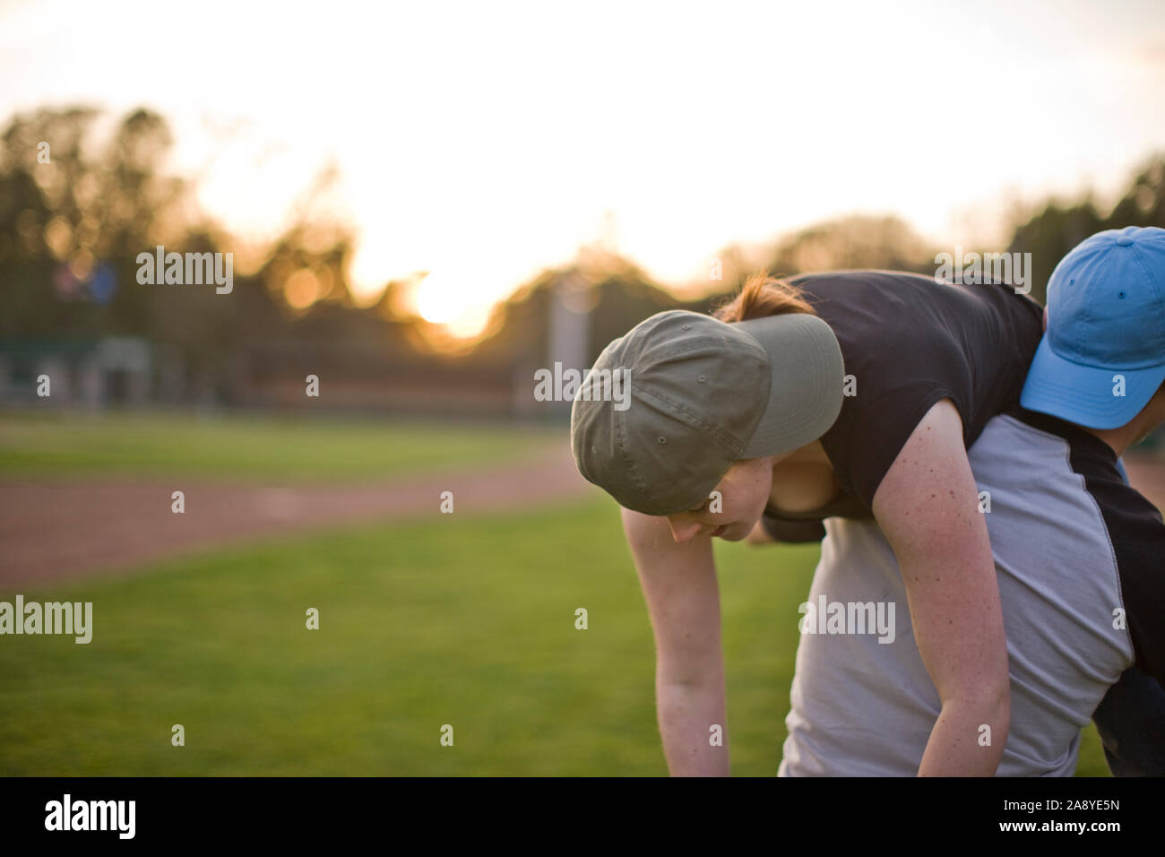 Smiling young woman being carried over her boyfriend's shoulder Stock ...