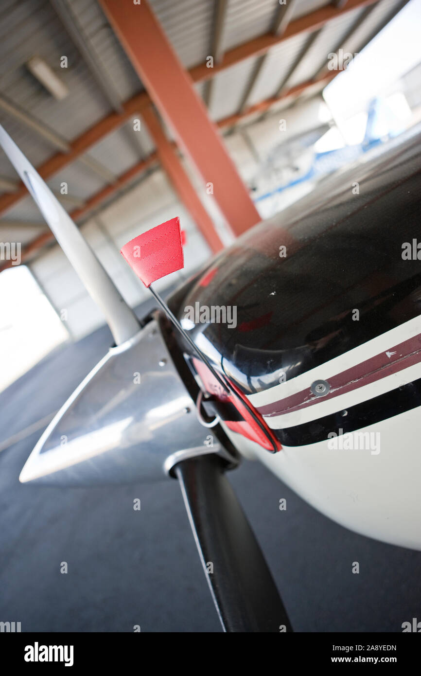 Red flag attached to the front of an airplane propeller Stock Photo - Alamy