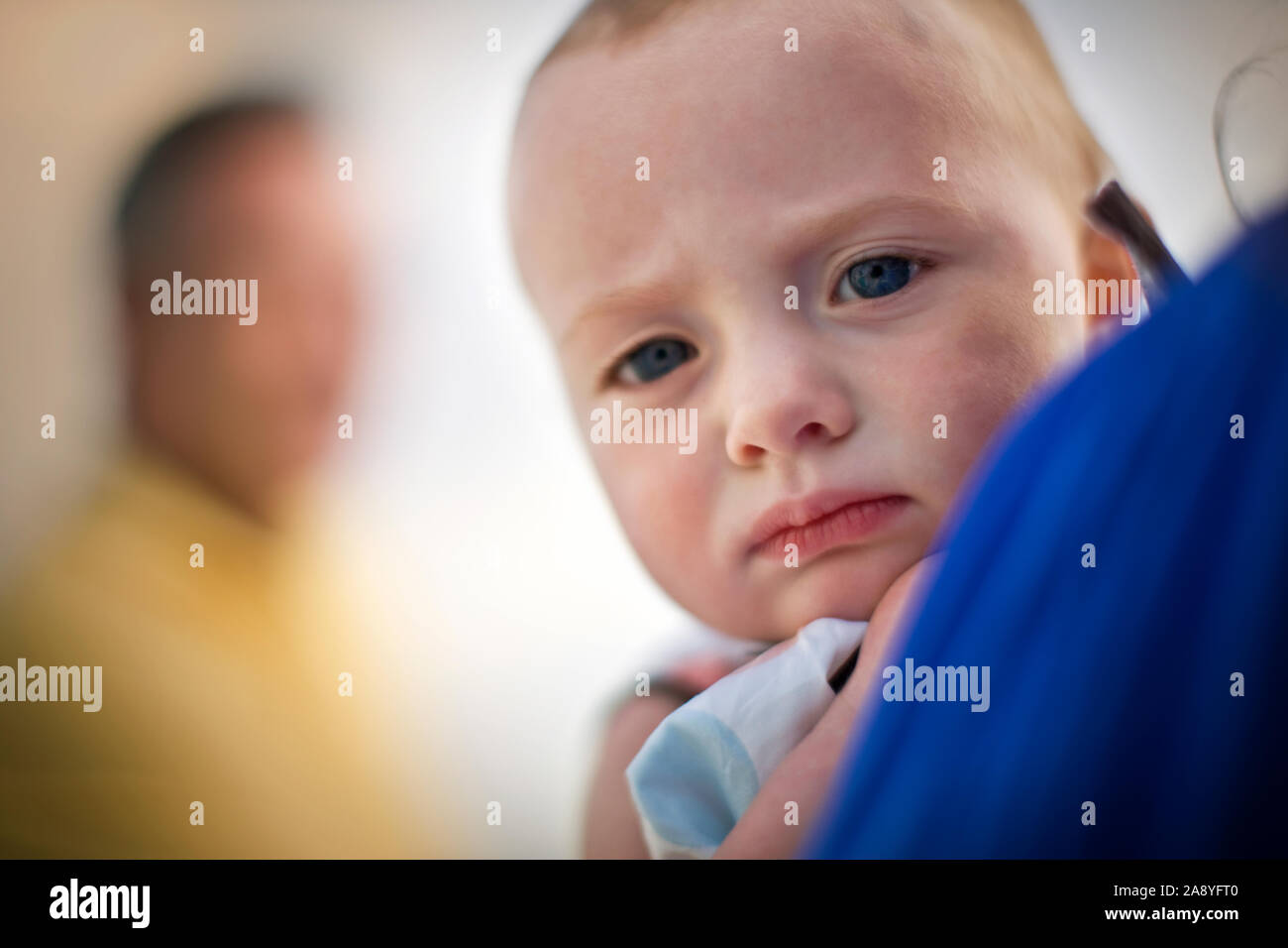Portrait of a young toddler being held Stock Photo - Alamy