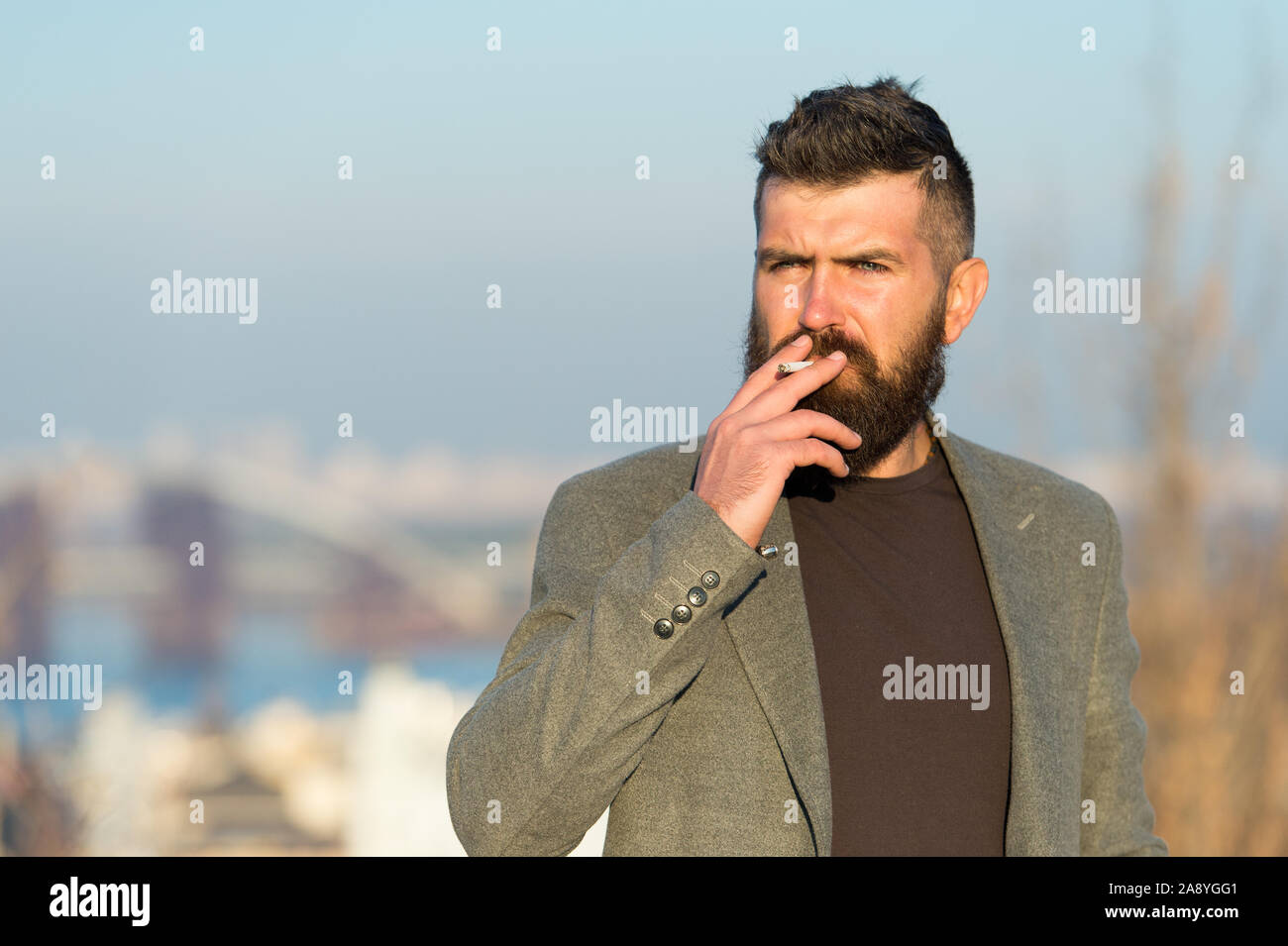 Nicotine abuse. Cigarette smoker. Bearded man smoke nicotine cigarette ...