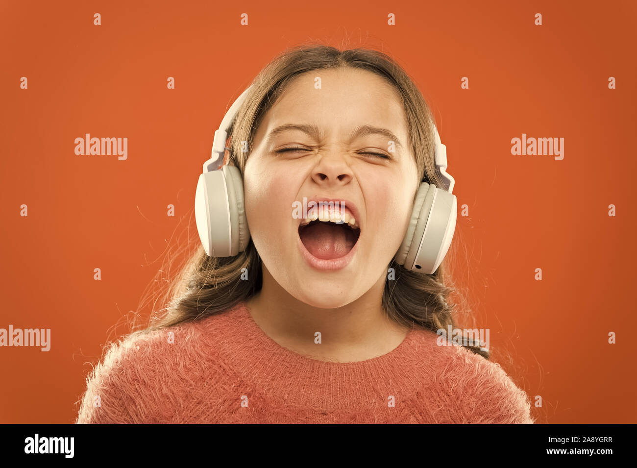 For better vocal performances. Adorable small child doing vocal on song ...