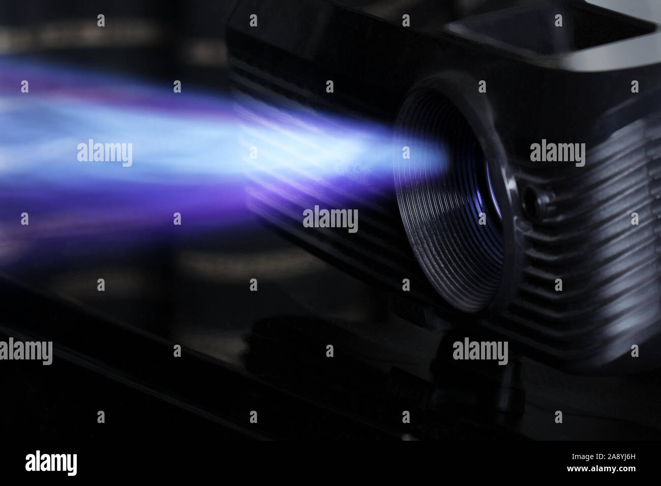 beamer light shining with a bright beam Stock Photo - Alamy