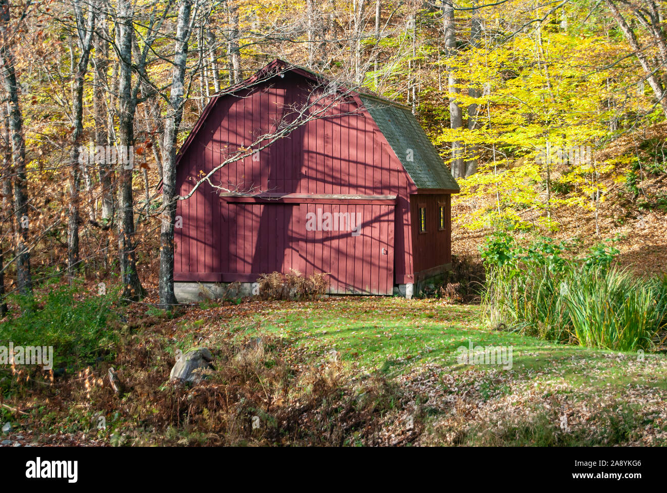 A generic red barn with fall foliage Stock Photo - Alamy