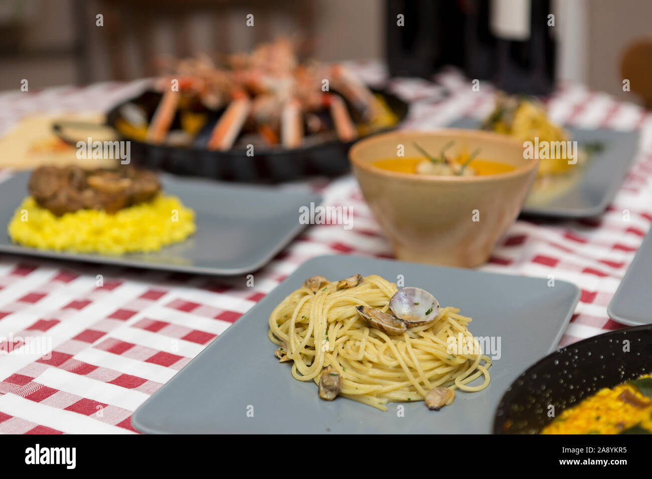 Detail of a prepared restaurant dinner table with miscellaneous recipes ...