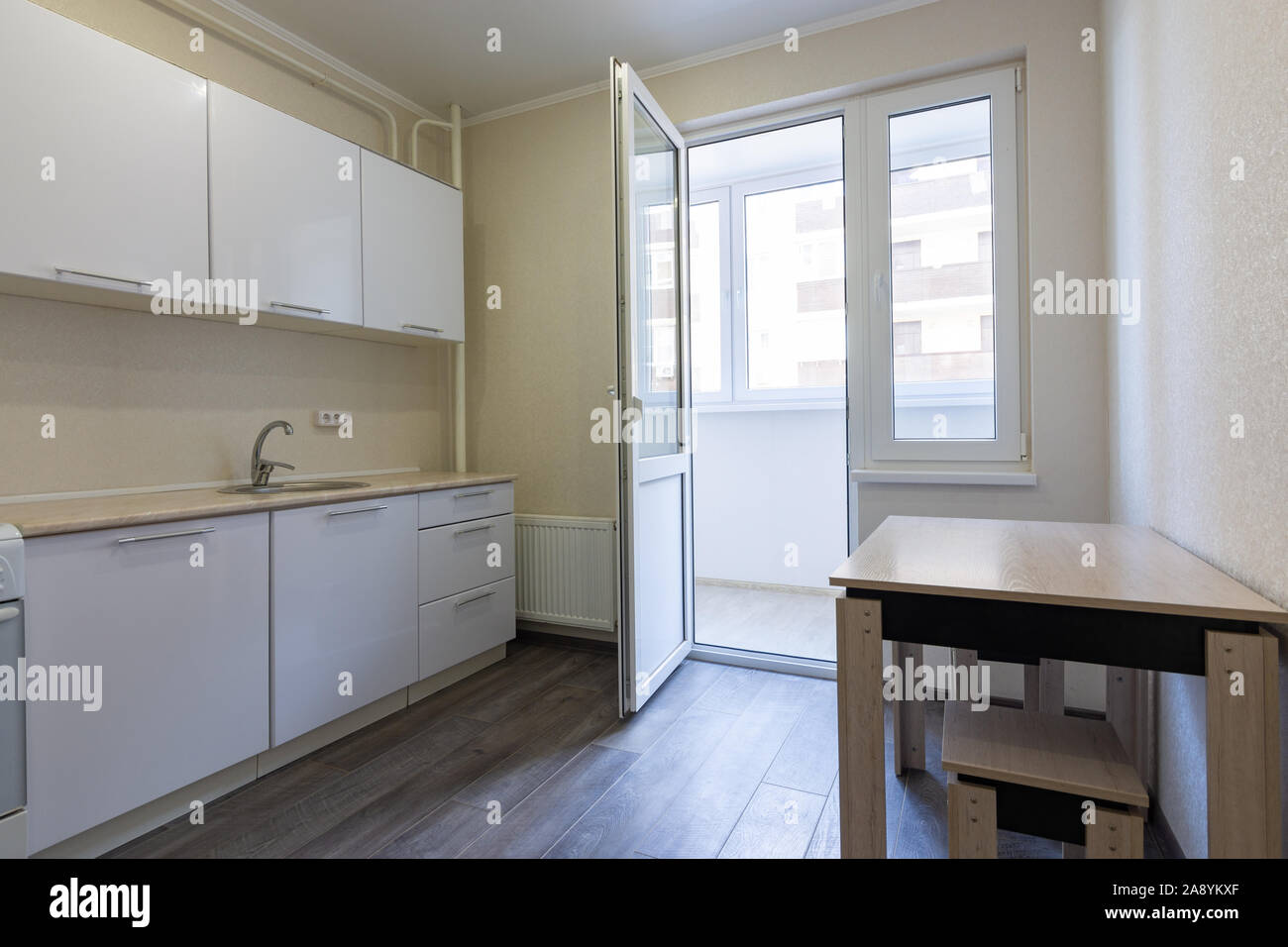 Interior of a small kitchen for rent Stock Photo - Alamy