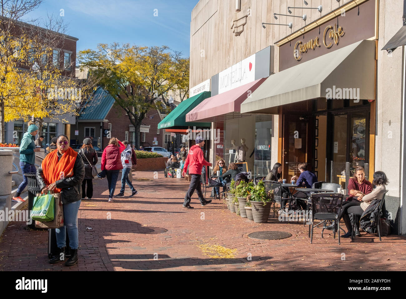 People sitting outside enjoying a sunny fall day Stock Photo - Alamy