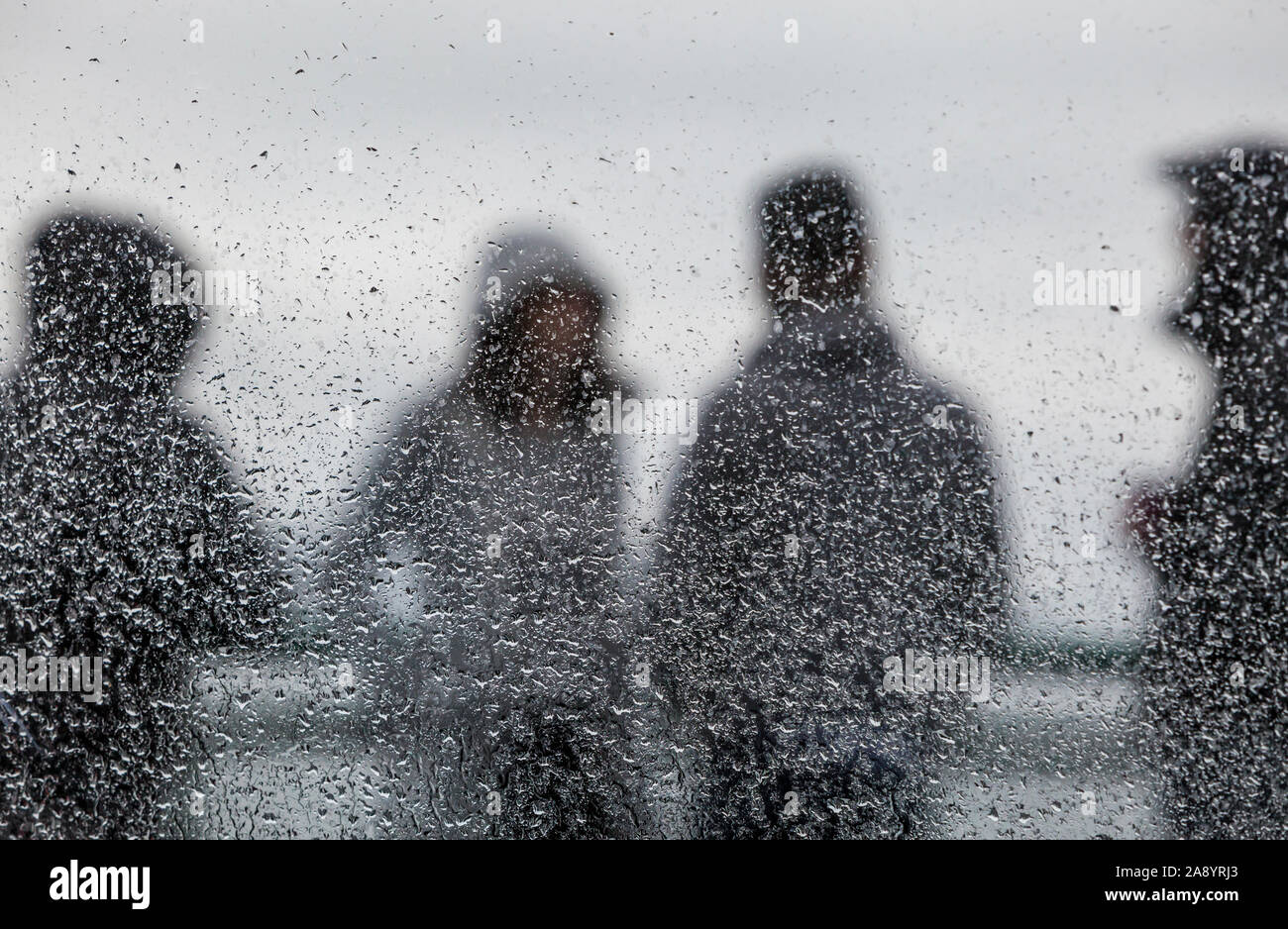 Hooded groups hi-res stock photography and images - Alamy