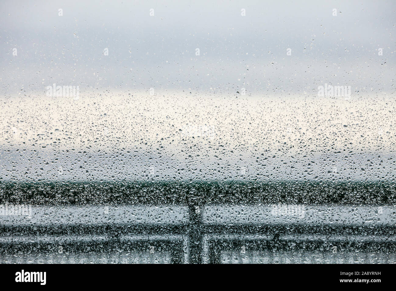 Looking through windows covered with raindrops on the Washington State ...