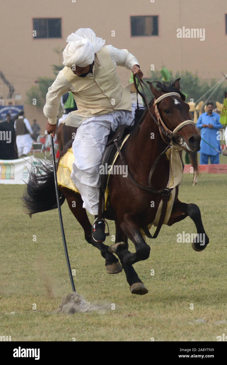 Pakistani horse and camel rider player in action during third Sarsabz ...