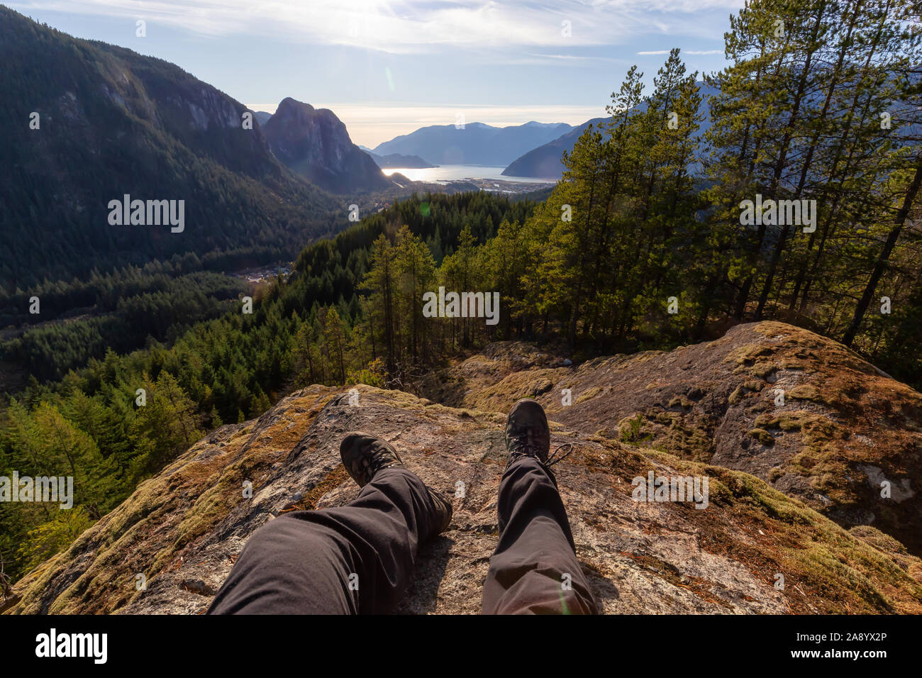 Sitting on the edge of a cliff and enjoying the Beautiful Canadian ...