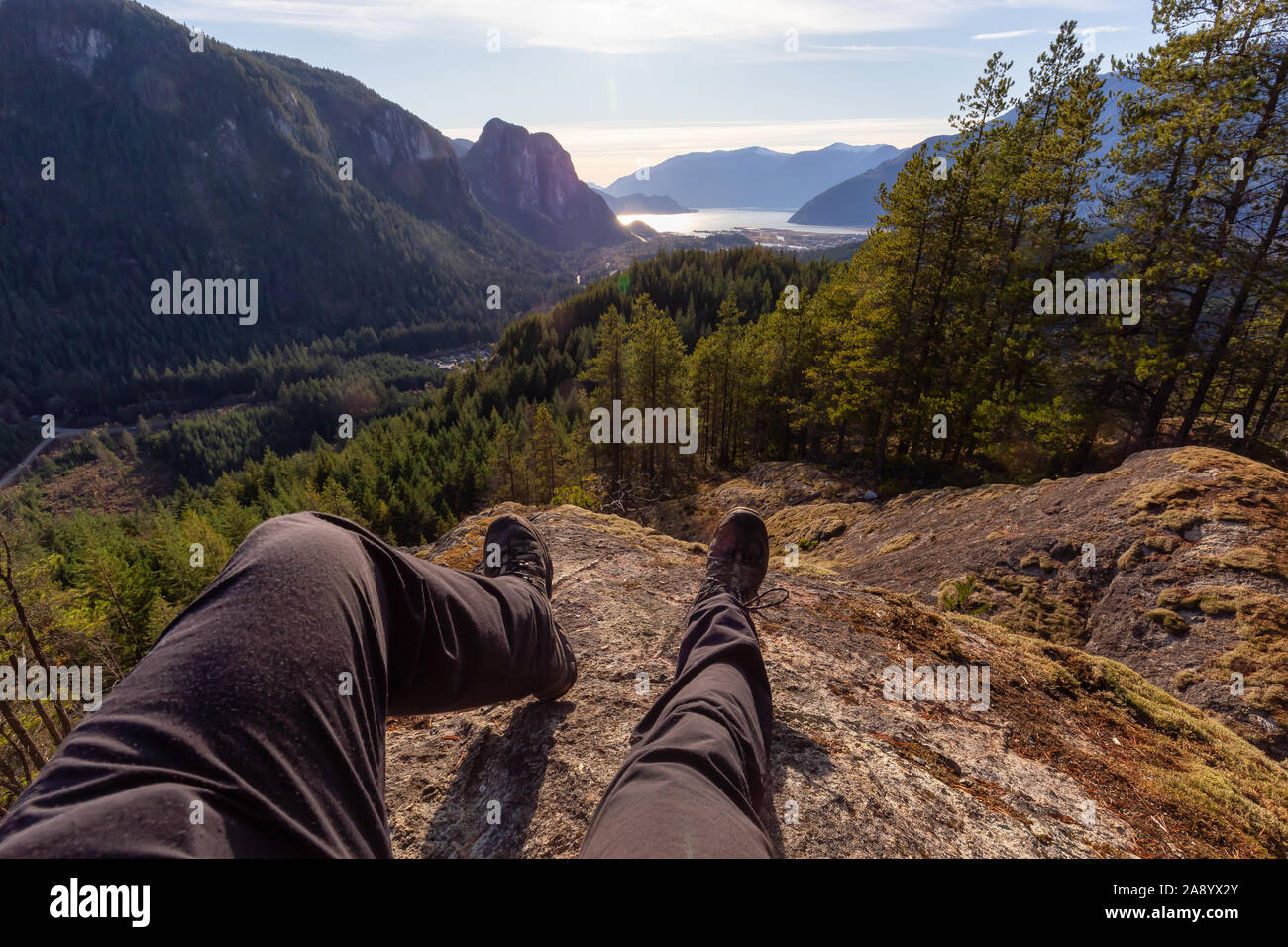 Sitting on the edge of a cliff and enjoying the Beautiful Canadian ...