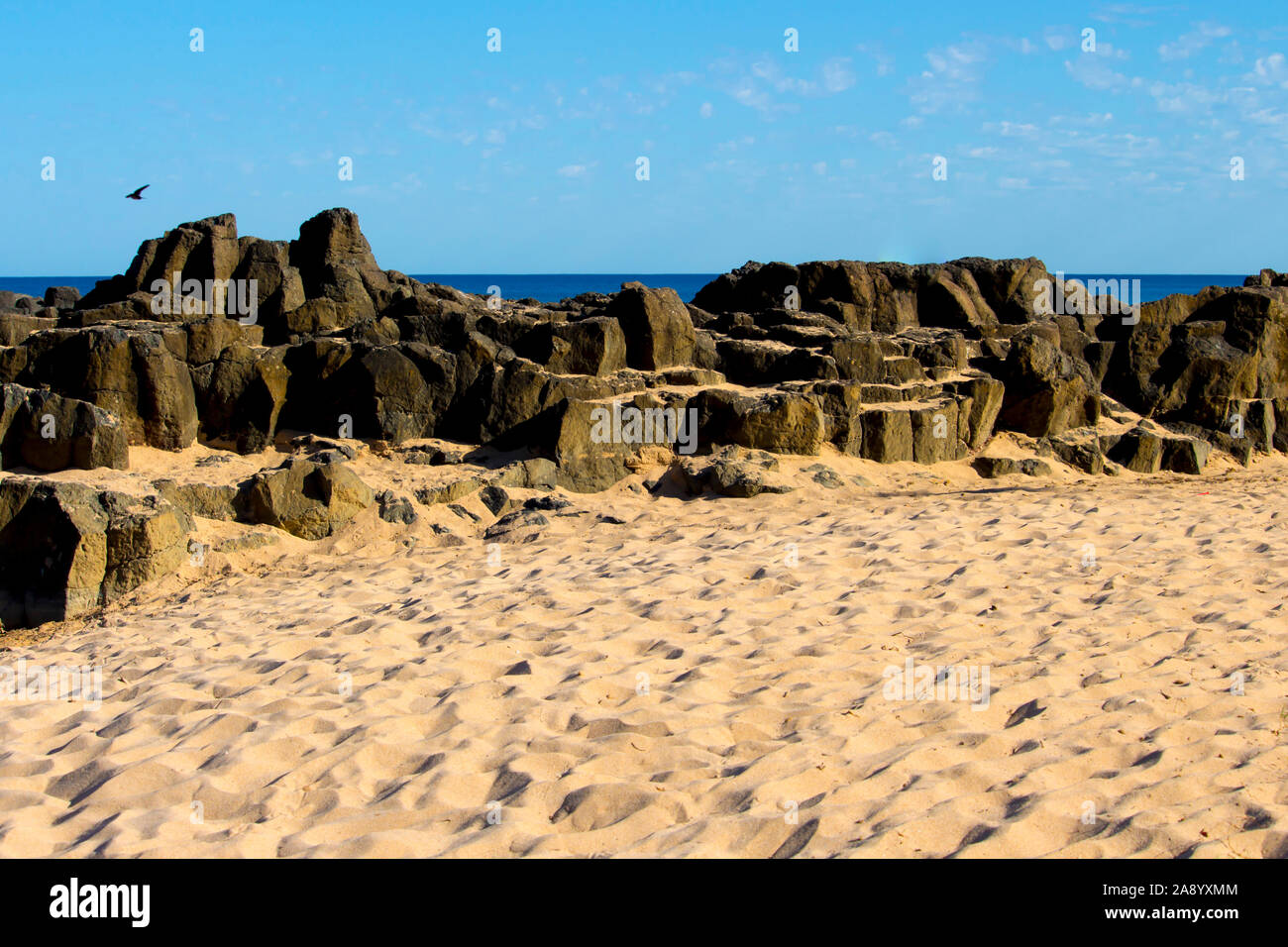 The Indian Ocean waves at high tide will be breaking on basalt rocks at ...