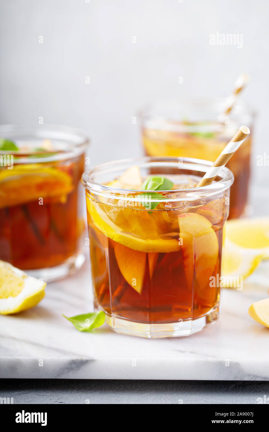 Peach and lemon sweet iced tea on a marble surface Stock Photo - Alamy