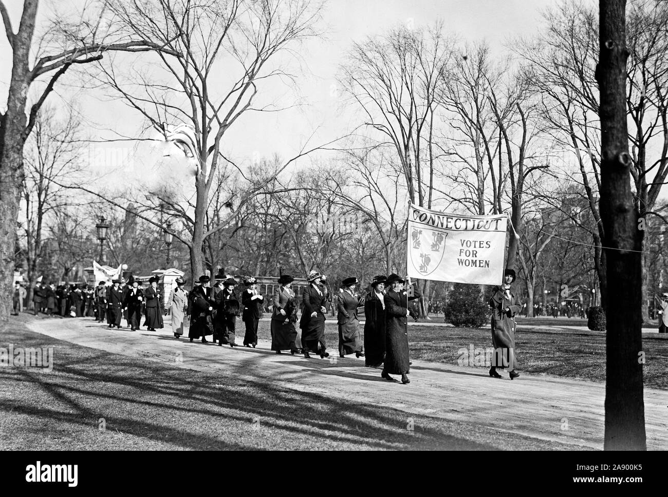 Woman suffragettes marching to the White House holding banners ca. 1914 ...
