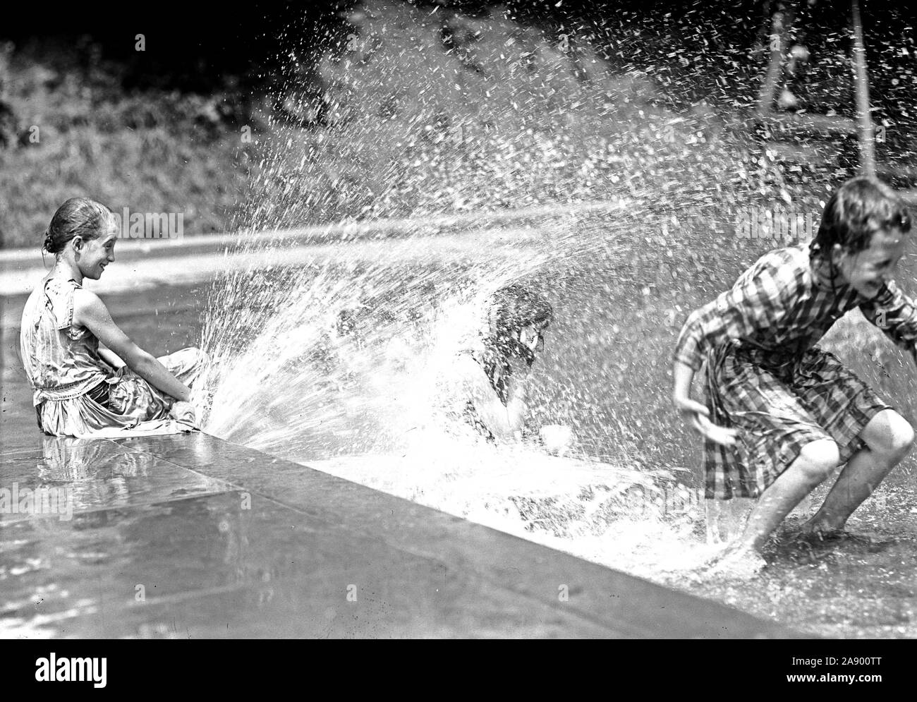 Children playing in a swimming pool ca. 1912 Stock Photo - Alamy