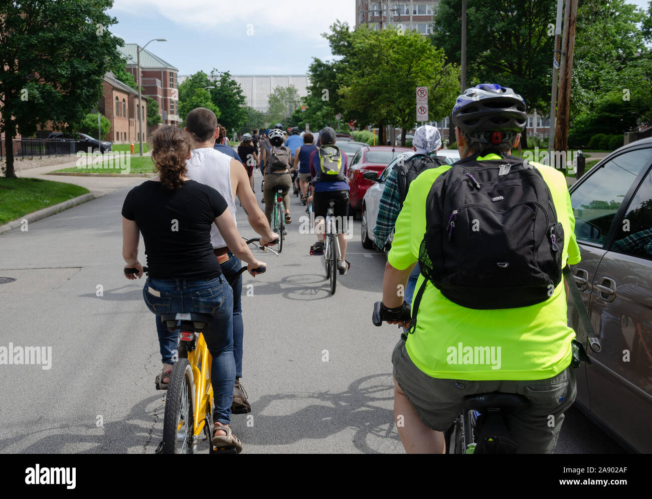 A group of community cyclists go for a bike ride together Stock Photo ...
