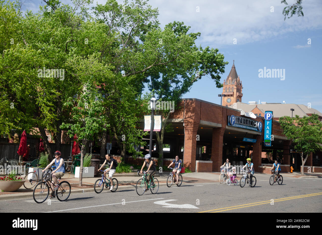 A group of community cyclists go for a bike ride together Stock Photo ...
