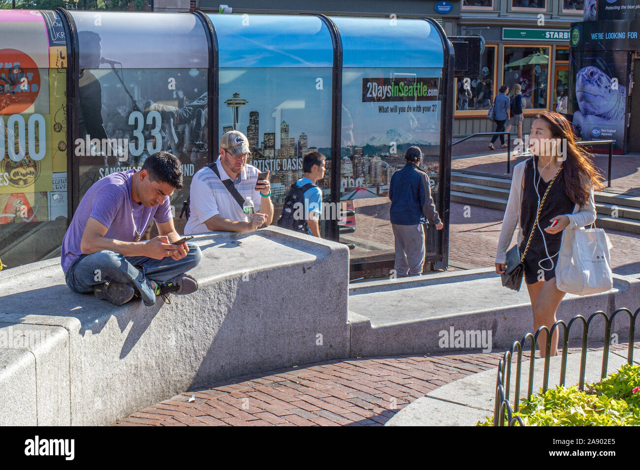 People gathering in a public place in Harvard Square on a nice summer ...