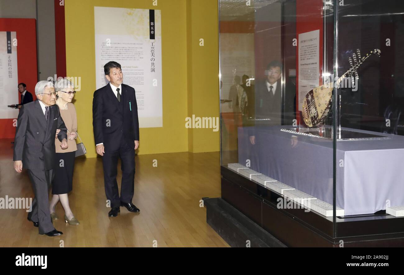Former Japanese Emperor Akihito and Empress Michiko look at an 8th ...