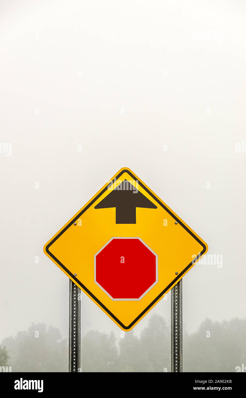 Arrow and octagon to warn of a stop sign ahead Stock Photo - Alamy