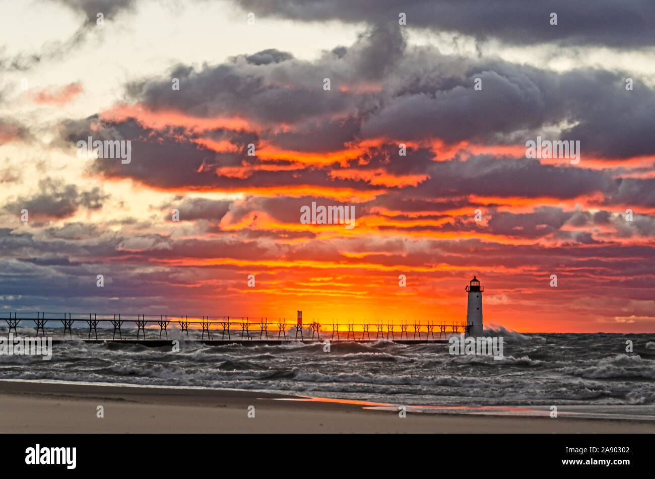 Sunset lighting up the sky giving it the look of fire over Lake ...