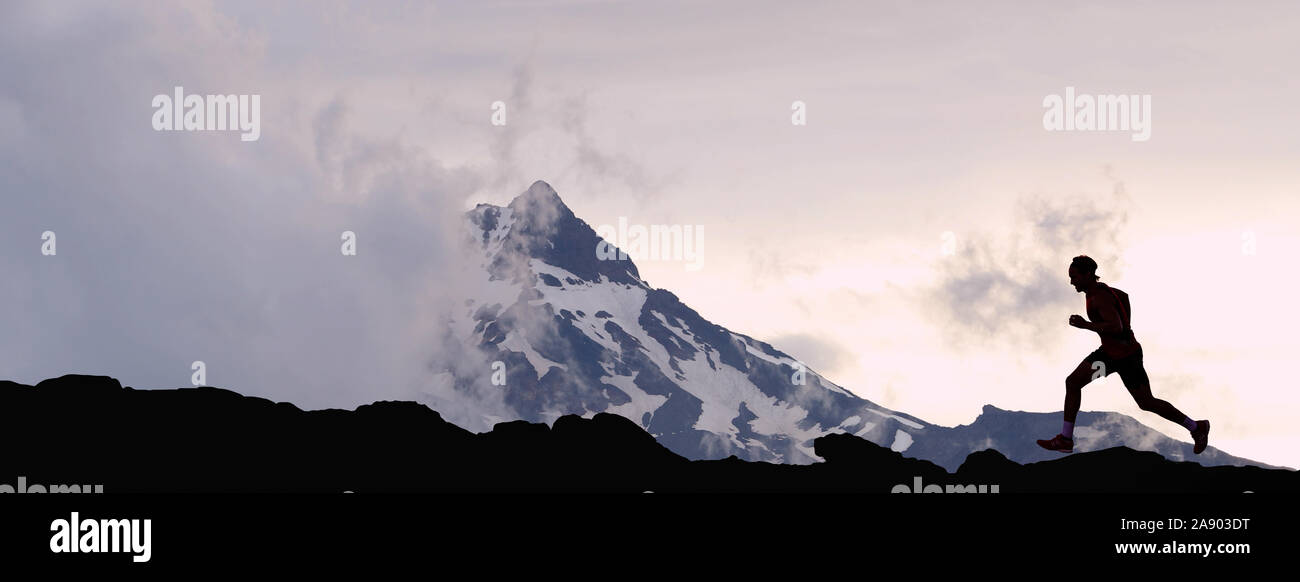 Running man athlete silhouette trail running in mountain summit ...