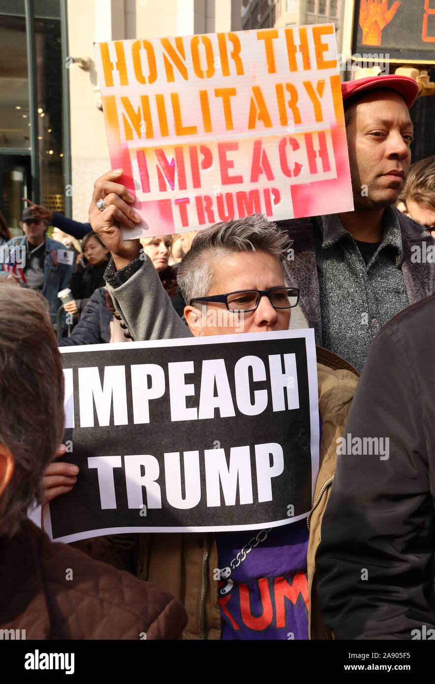 New York, New York, USA. 11th Nov, 2019. People hold signs at the 100th ...