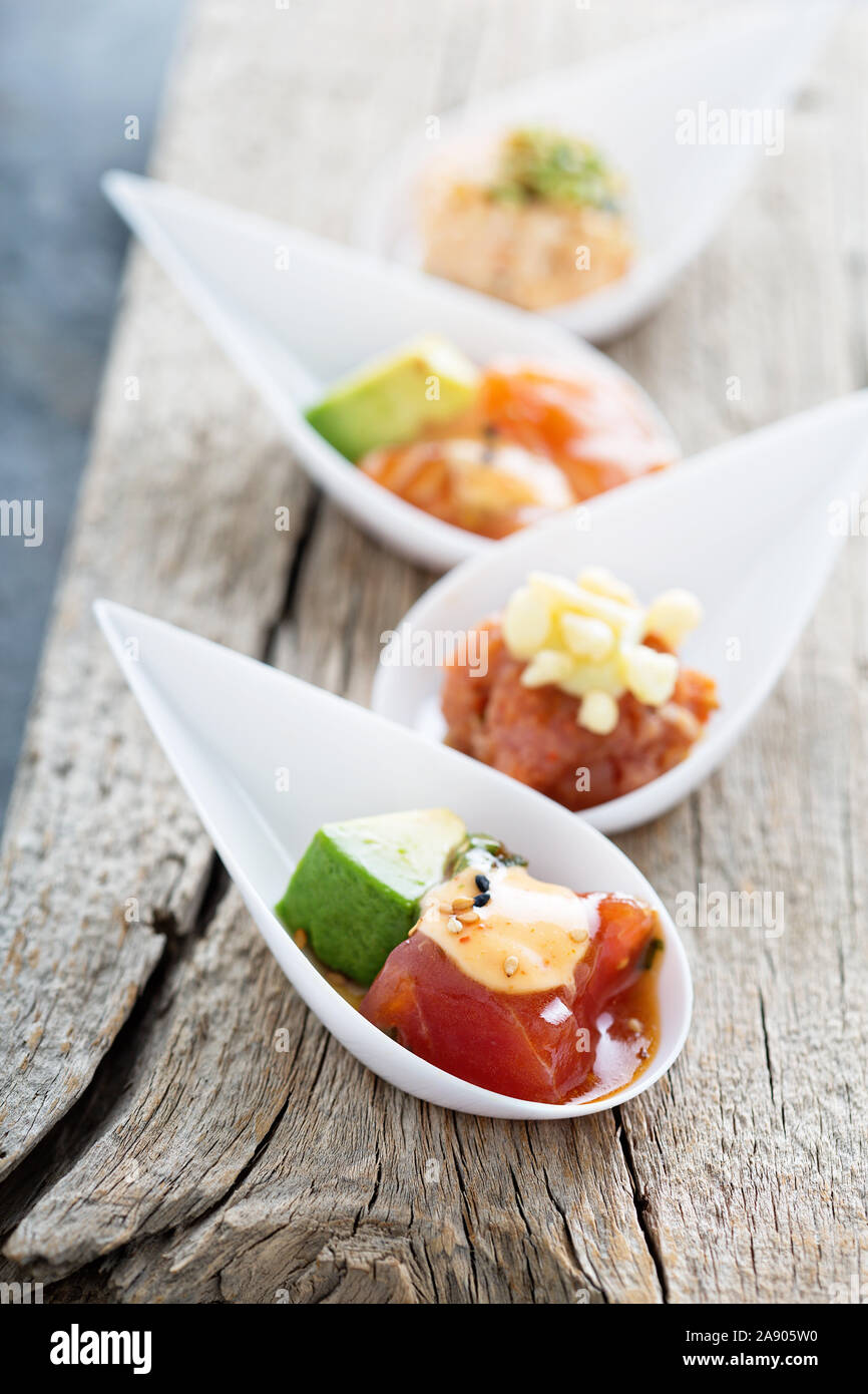 Asian inspired sushi bites appetizer with tuna and salmon Stock Photo ...