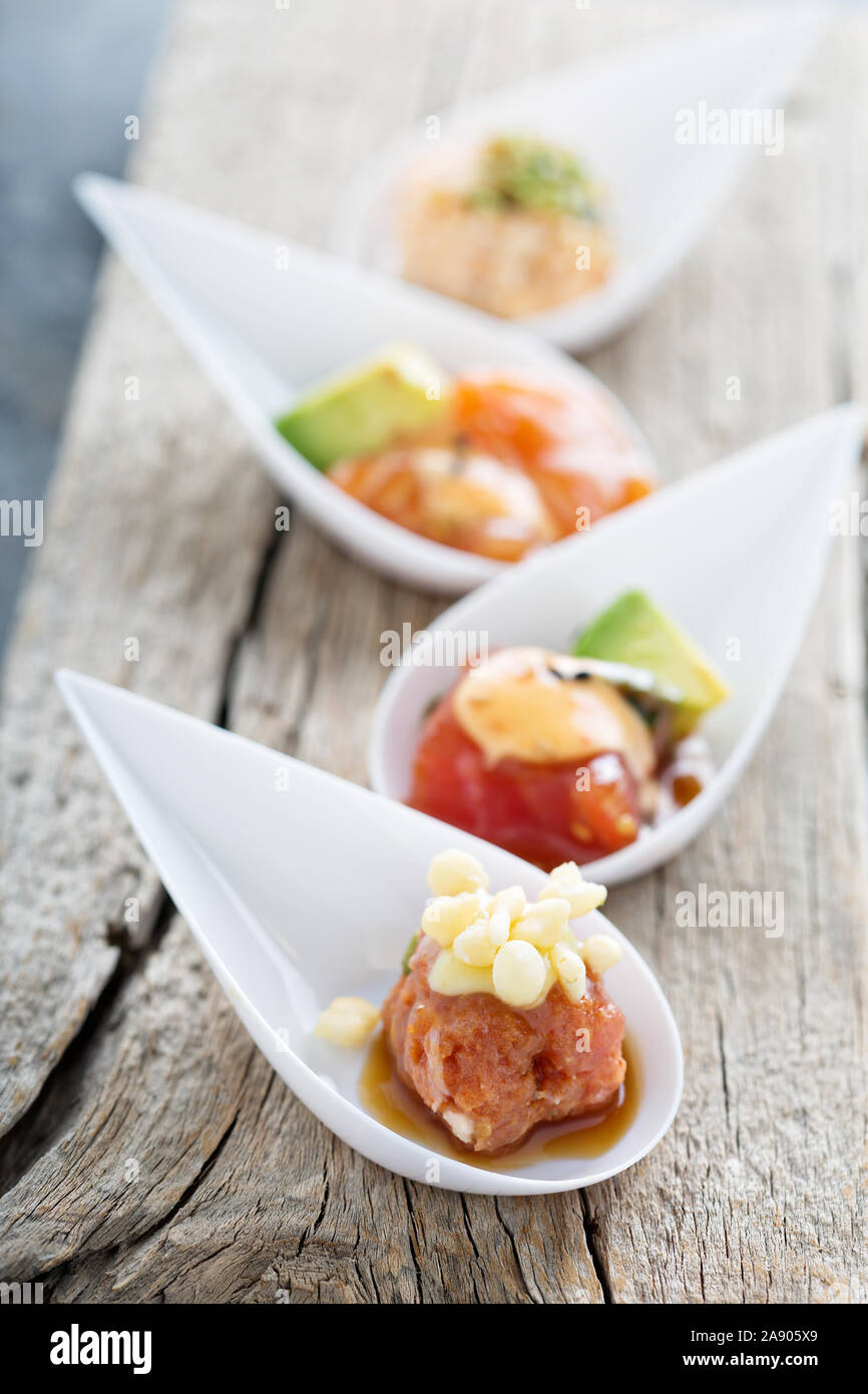 Asian inspired sushi bites appetizer with tuna and salmon Stock Photo ...