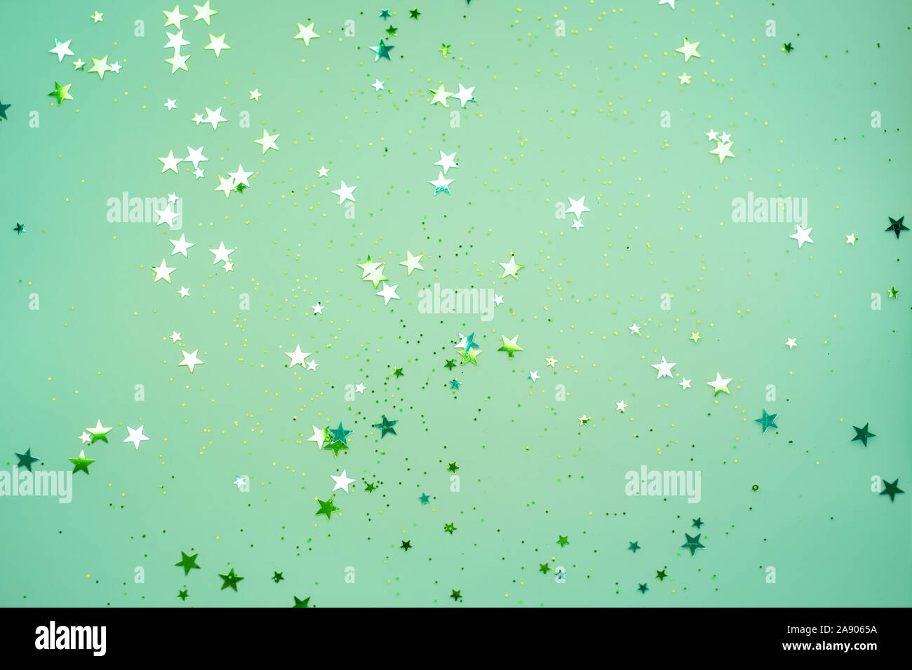 Scattered stars on a mint color background, Christmas, New year ...